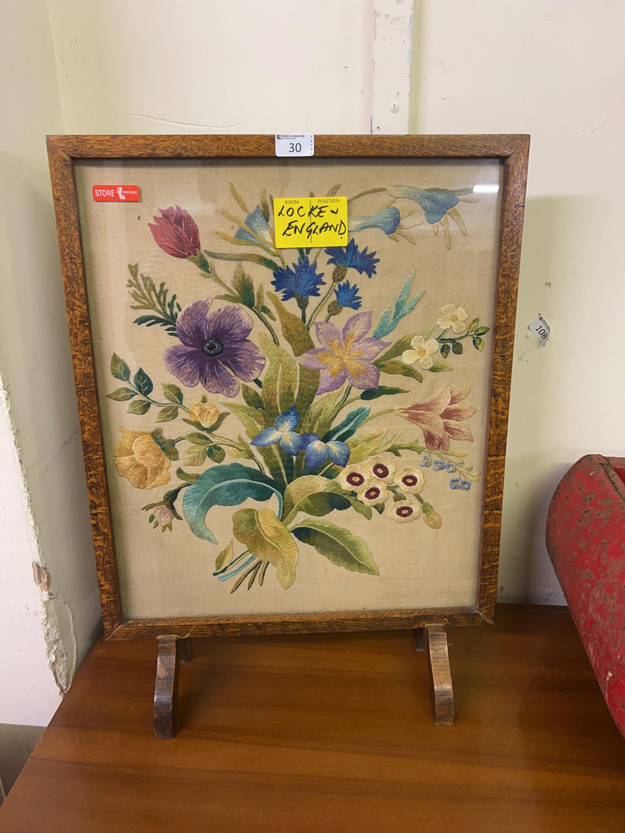 Lot 30 - A mid-20th century oak framed fire screen